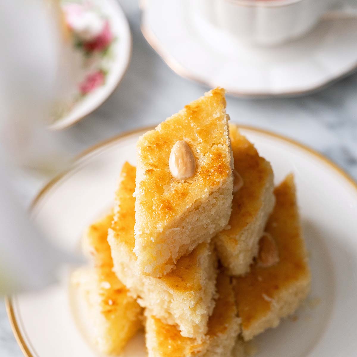 Basbousa Recipe (Middle Eastern Coconut Semolina Cake) - An Edible Mosaic™