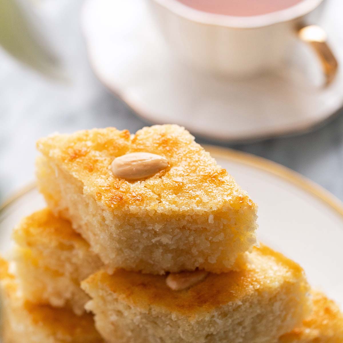 Basbousa Recipe (Middle Eastern Coconut Semolina Cake) - An Edible Mosaic™