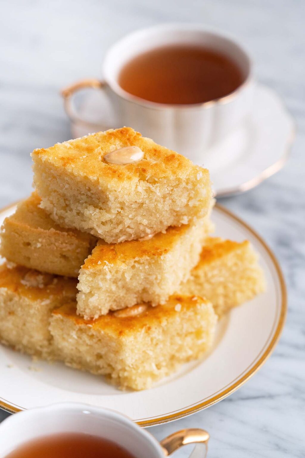 Basbousa Recipe (Middle Eastern Coconut Semolina Cake) - An Edible Mosaic™